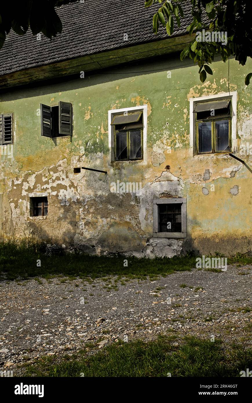 Flaking facade by the entrance to Predjama Castle, Predjamski grad or ...