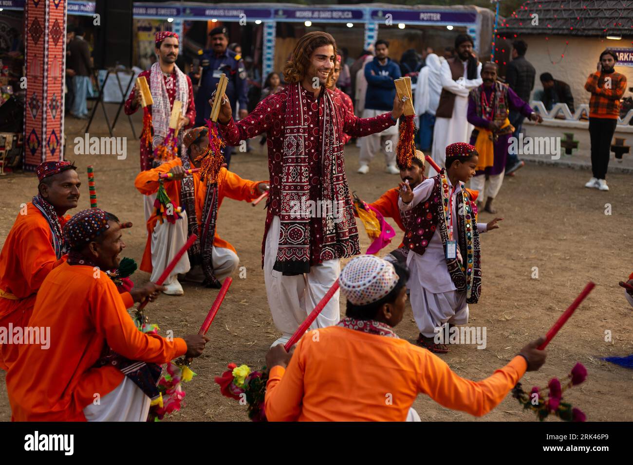 A group of dancers in traditional clothing from the province of Sindh ...