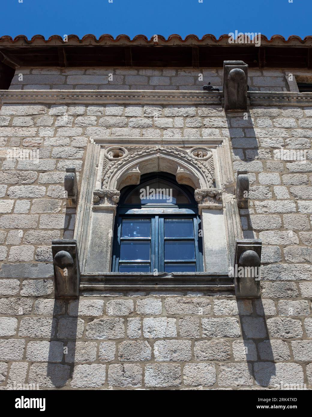 Old stone building texture background street view wall Stock Photo - Alamy