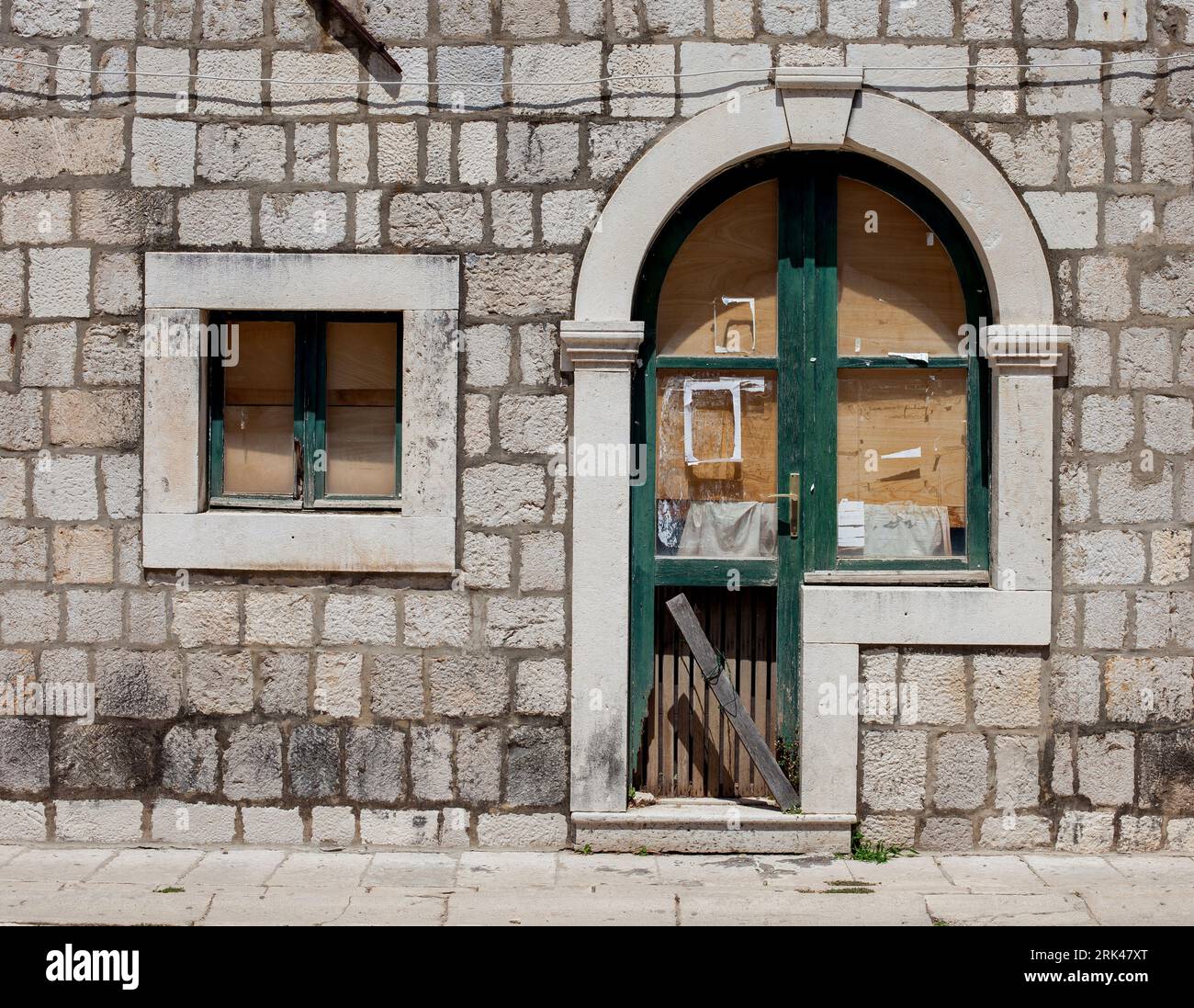 Old stone building texture background street view wall Stock Photo - Alamy