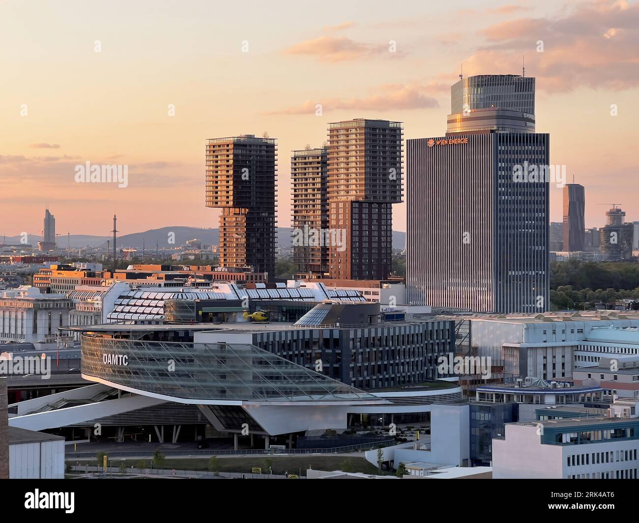 A vibrant cityscape with Karimi-design buildings along the banks of a ...