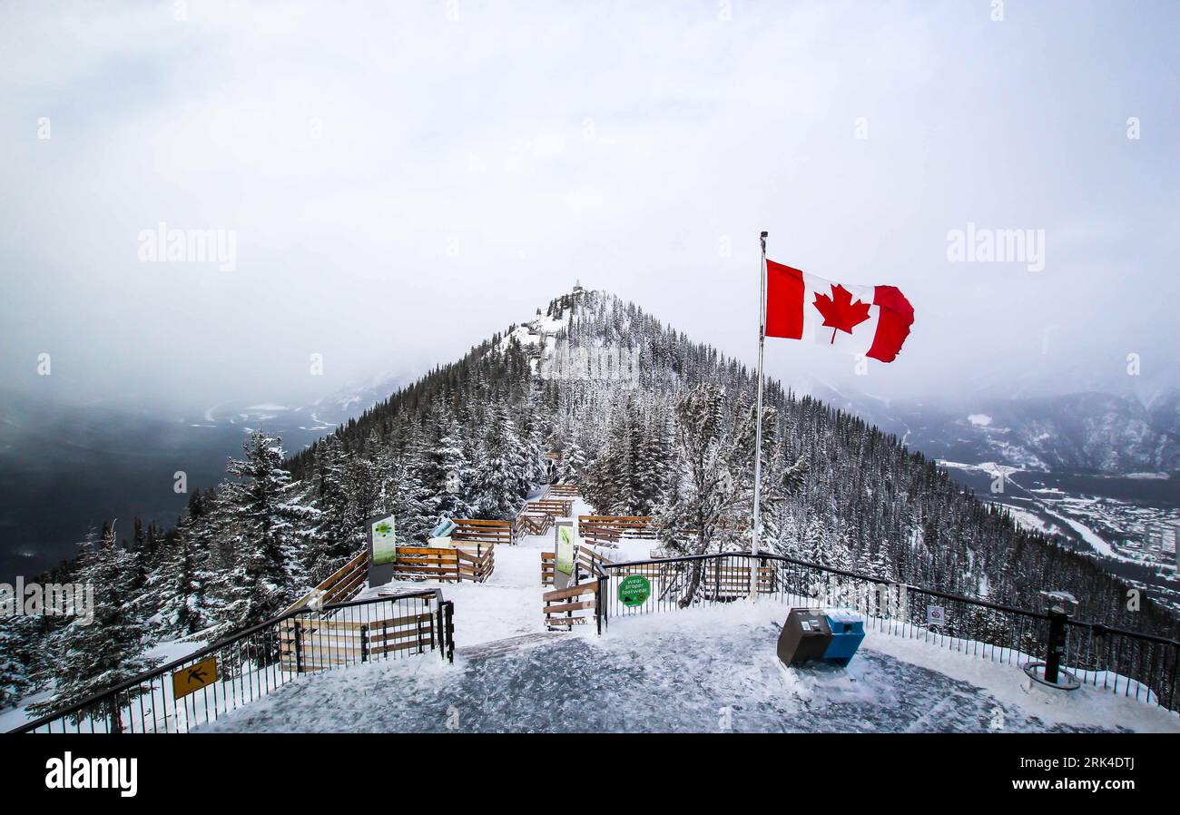 Banff, Canada, as snow-drenched mountain proudly displays the iconic ...