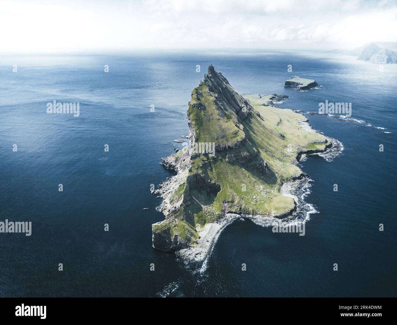 Drone shot of Drangarnir, the iconic sea stacks nestled between ...