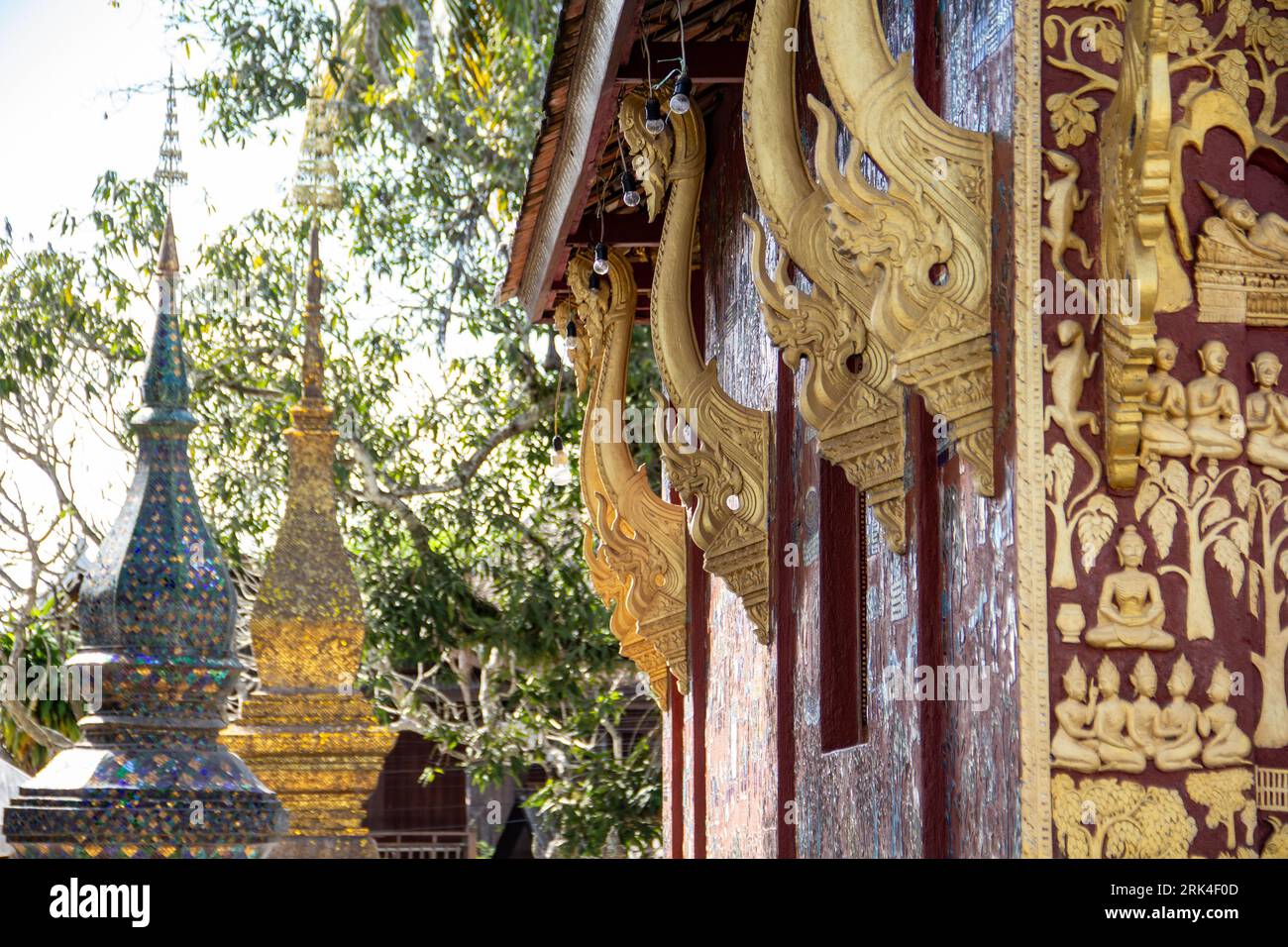 A towering architectural structure, with its facade adorned in golden ...