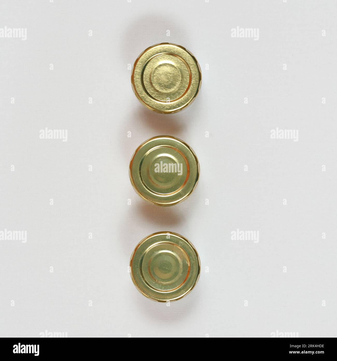 Three Small Jars With Golden Lids Top View Stock Photo - Alamy