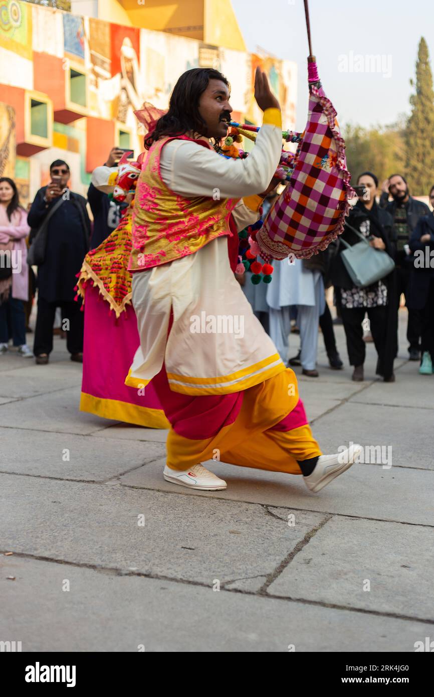 A musician wearing traditional attire during the Lok Mela festival in ...