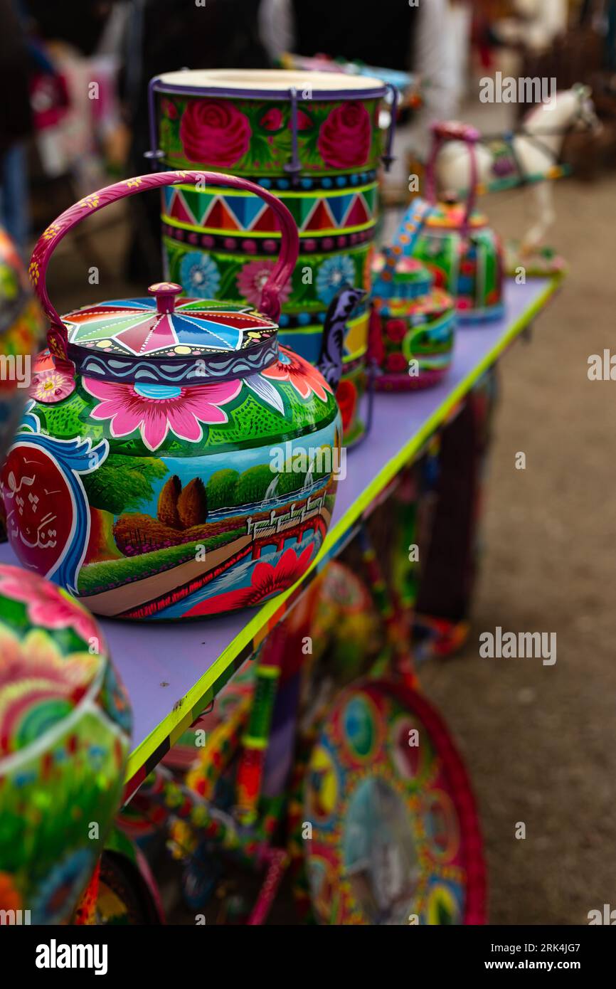 A close-up of gorgeous, hand-painted teapots on sale in Pakistan Stock ...
