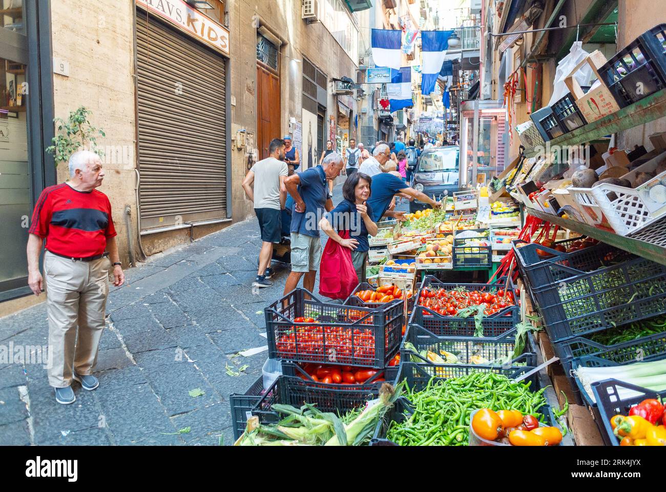 Naples, Metropolitan City of Naples, Italy, Neapolitan woman buying ...