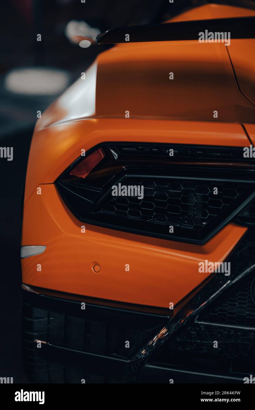 A rear close-up of a sleek, orange Lamborghini Stock Photo - Alamy