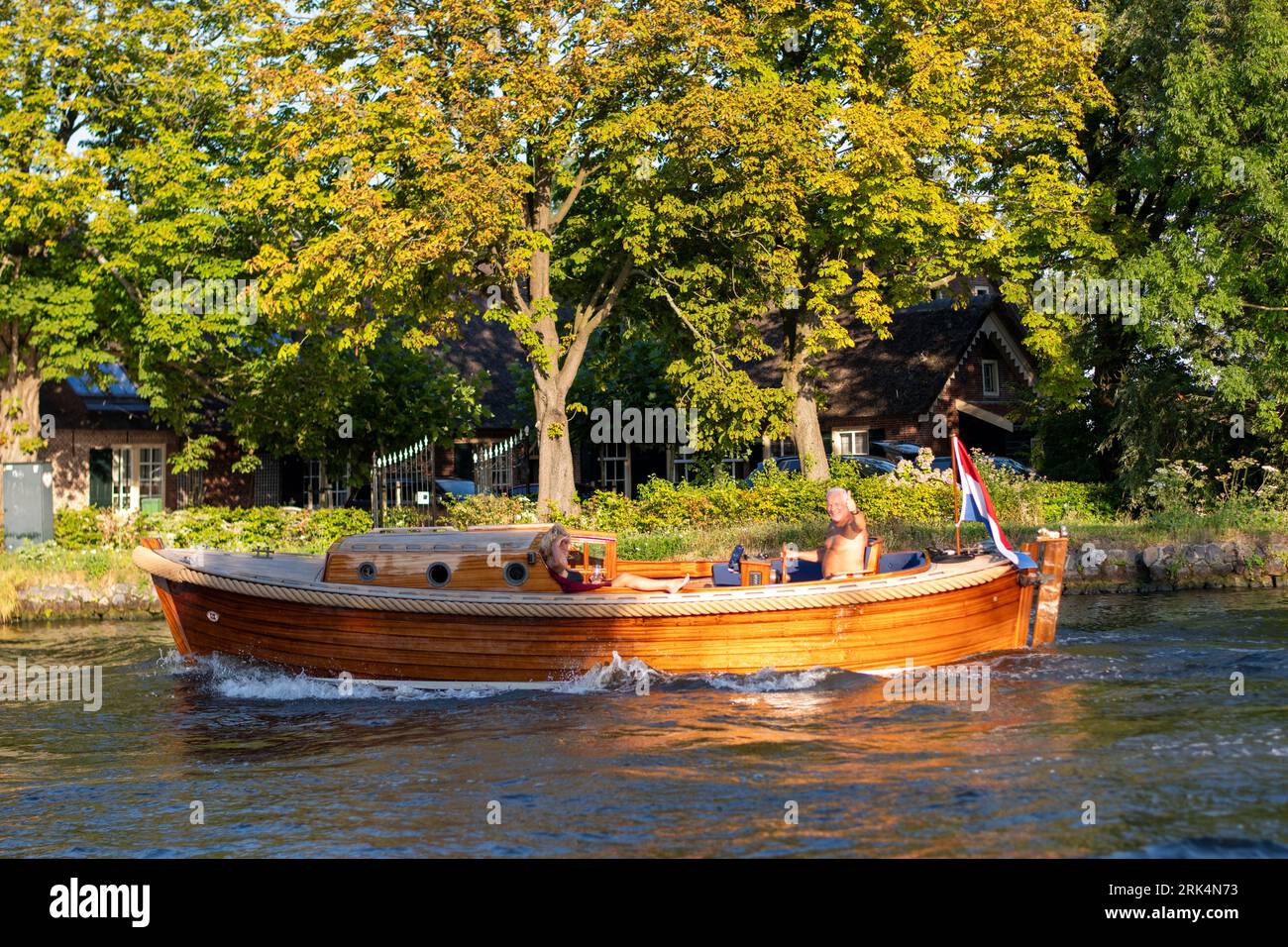 Wooden boat on Dutch river Stock Photo - Alamy