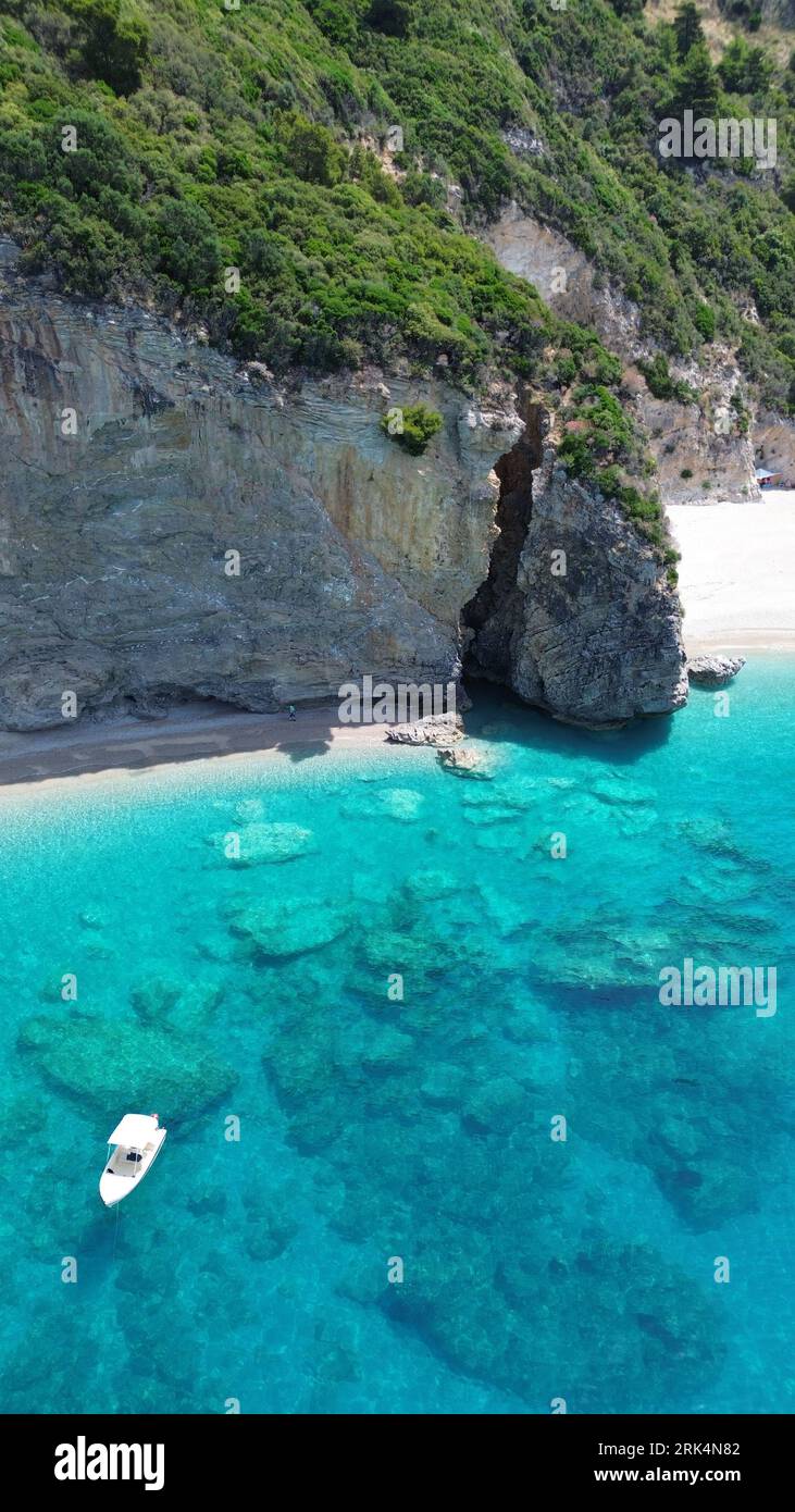 An aerial view of the rocky shoreline of Corfu, Greece with its crystal ...