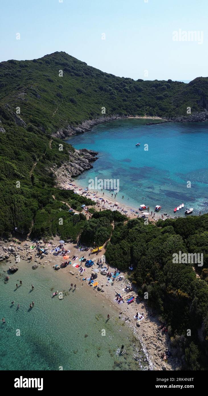 An aerial view of the rocky shoreline of Corfu, Greece with its crystal ...