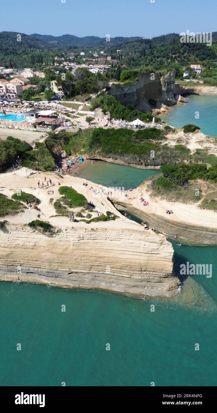An aerial view of the rocky shoreline of Corfu, Greece with its crystal ...