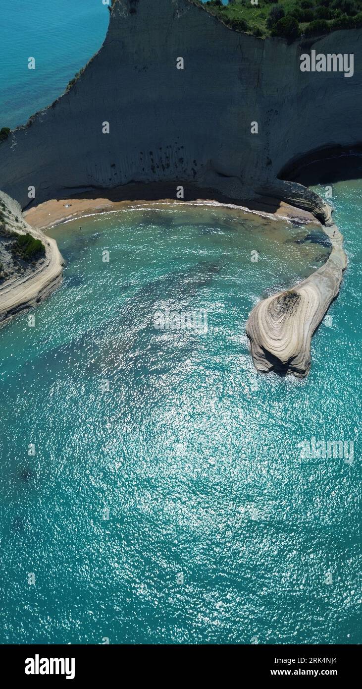 An aerial view of the rocky shoreline of Corfu, Greece with its crystal ...