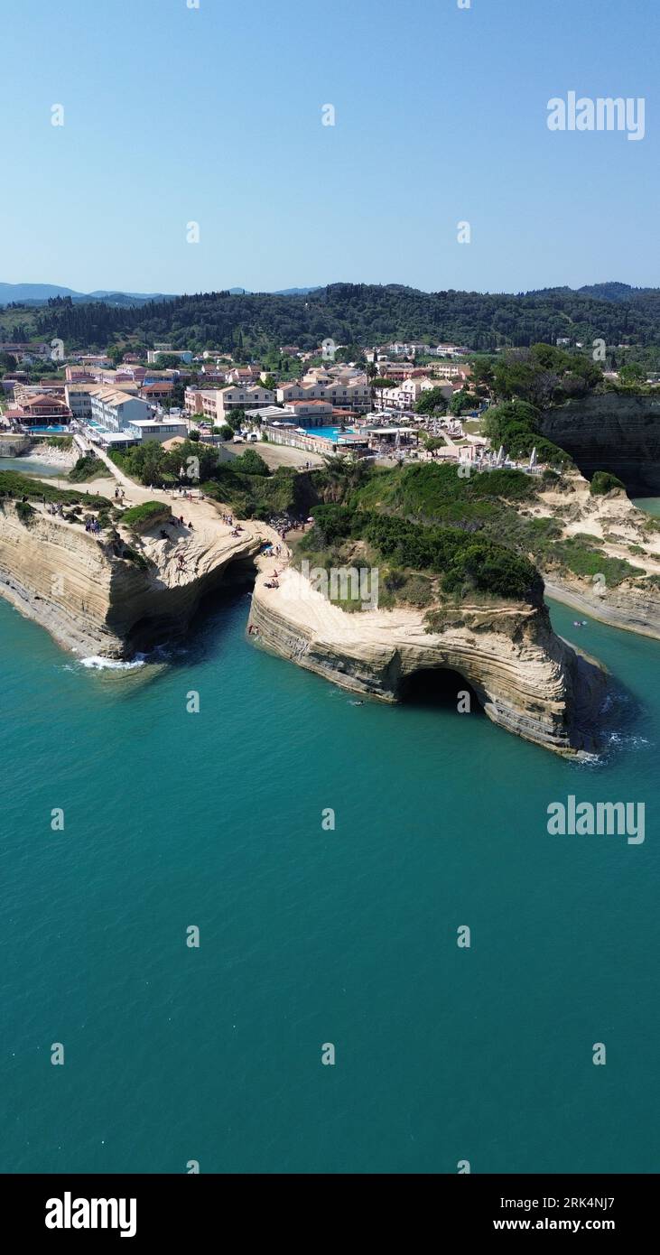 An aerial view of the rocky shoreline of Corfu, Greece with its crystal ...