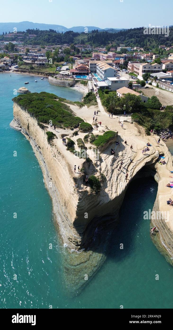 An aerial view of the rocky shoreline of Corfu, Greece with its crystal ...