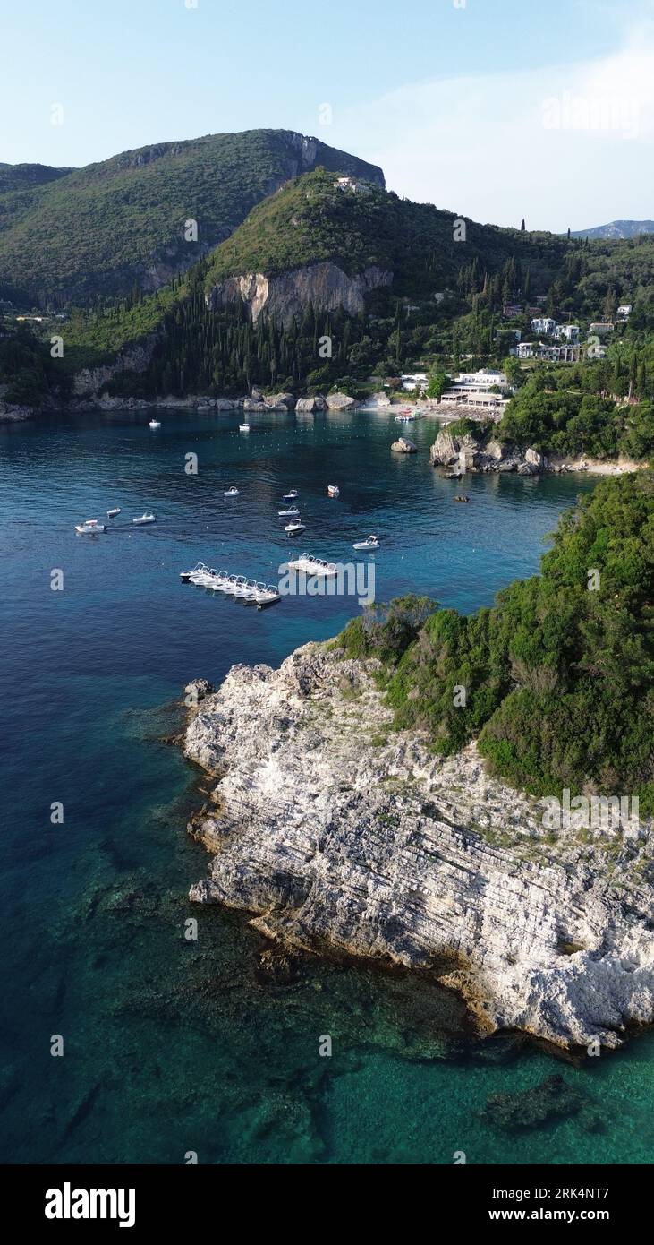 An aerial view of the rocky shoreline of Corfu, Greece with its crystal ...
