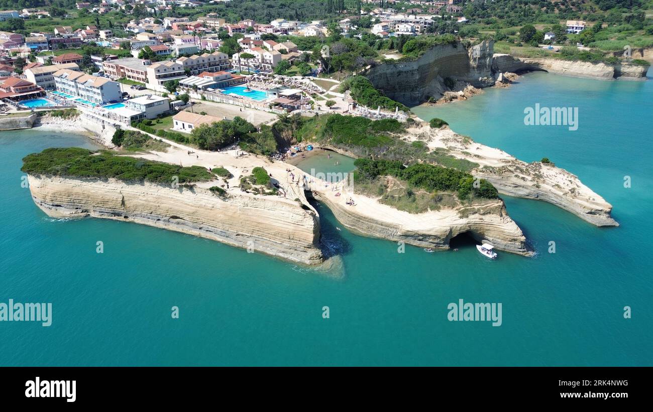 An aerial view of the rocky shoreline of Corfu, Greece with its crystal ...