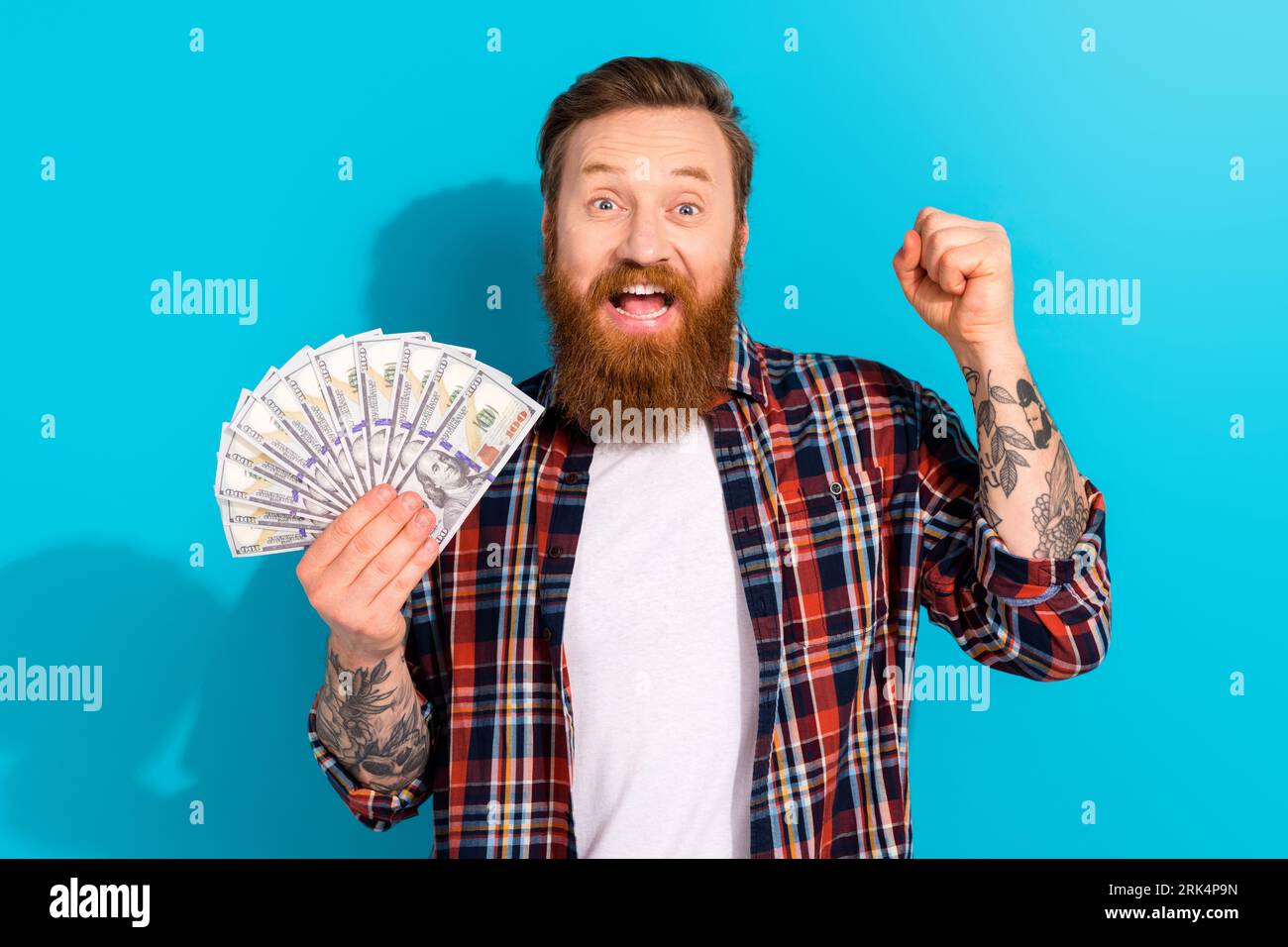 Portrait of crazy mature man red hair beard raised fist up hooray ...