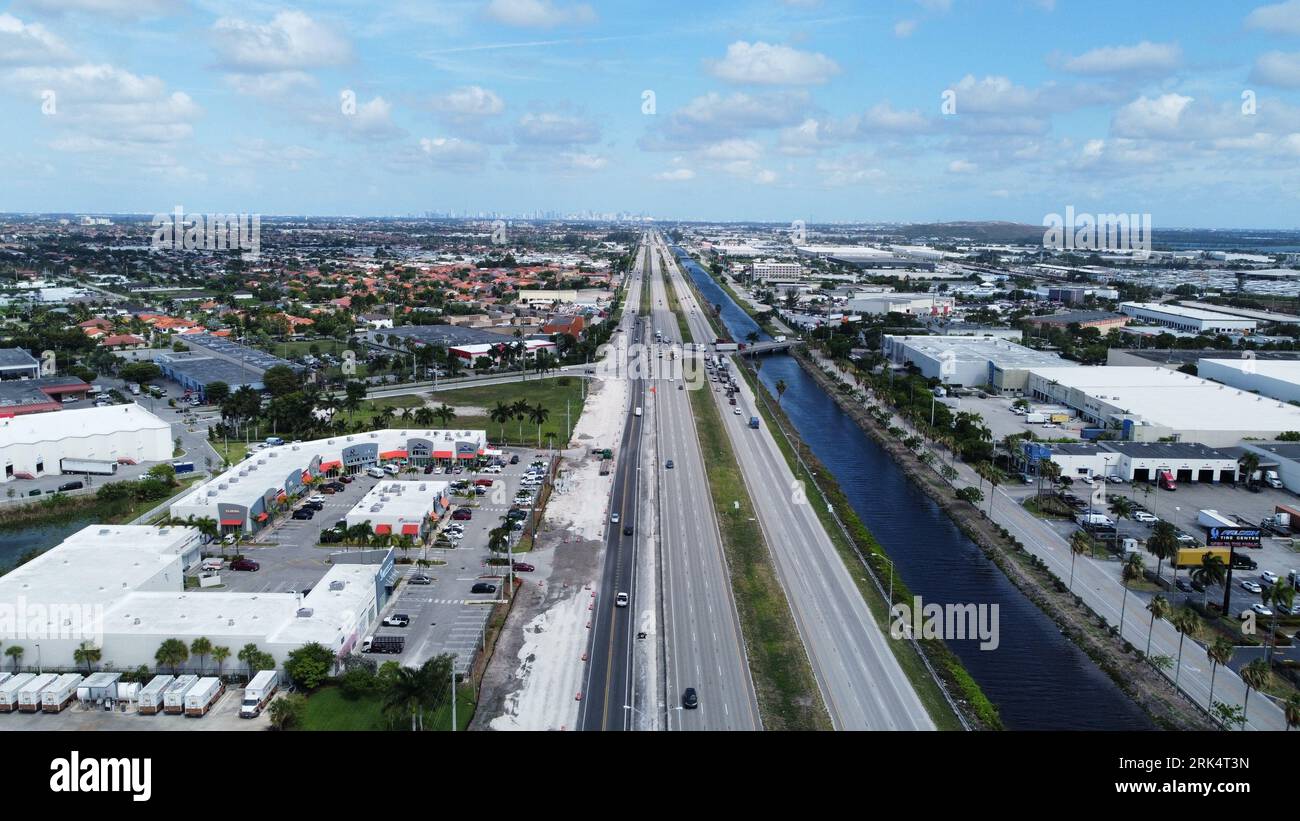 An aerial view of a highway with small buildings and vehicles Stock ...