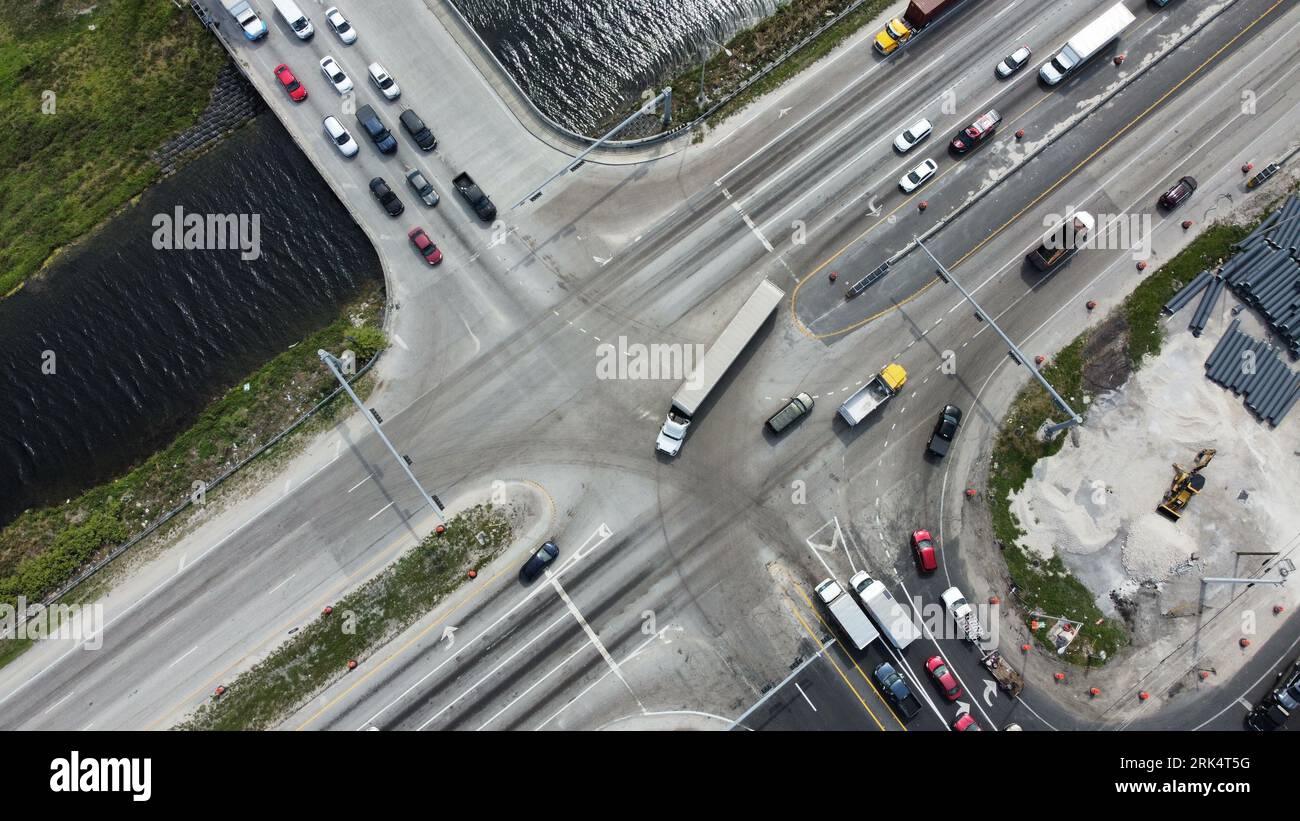 An aerial view of a highway with small buildings and vehicles Stock ...