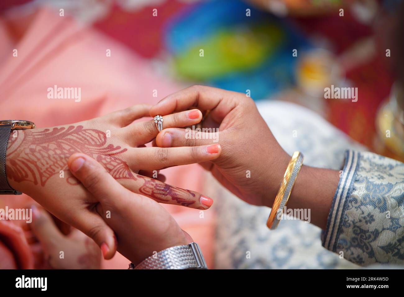 The hands of a couple just getting married Stock Photo - Alamy
