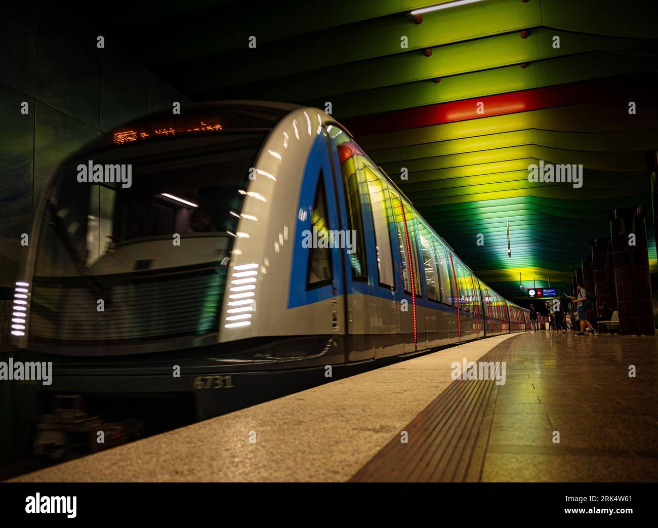 An incoming train in a subway station in Munich, Germany with ...