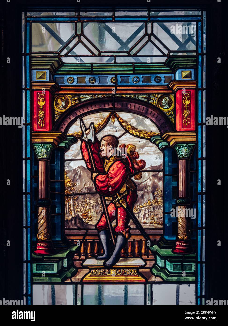 An intricately designed stained glass window featuring a detailed image ...