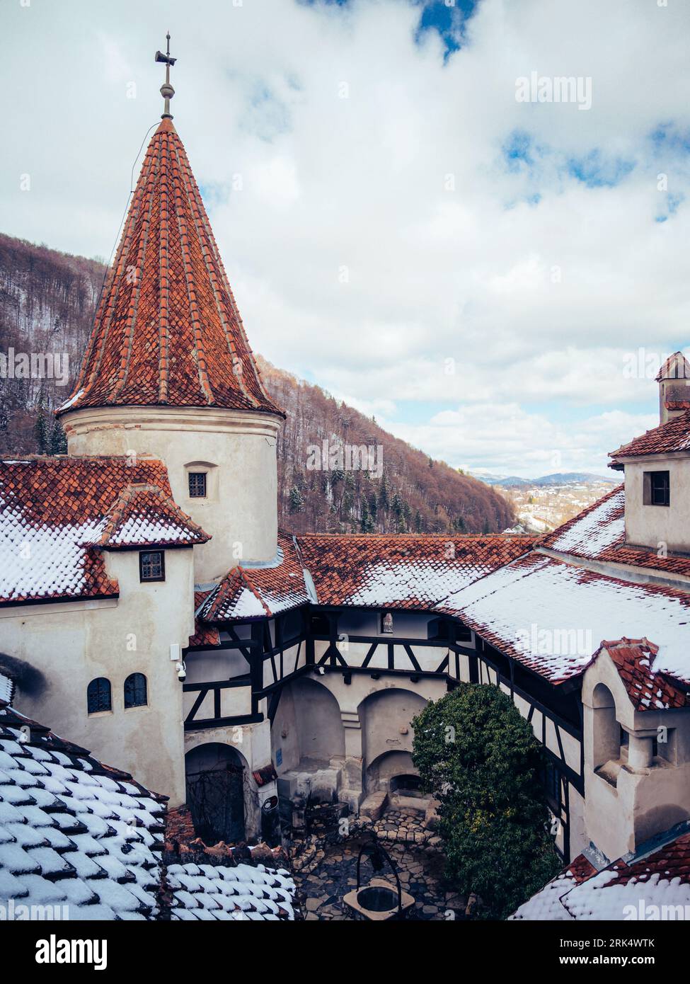 A beautiful winter scene featuring the Bran castle in Romania and a ...
