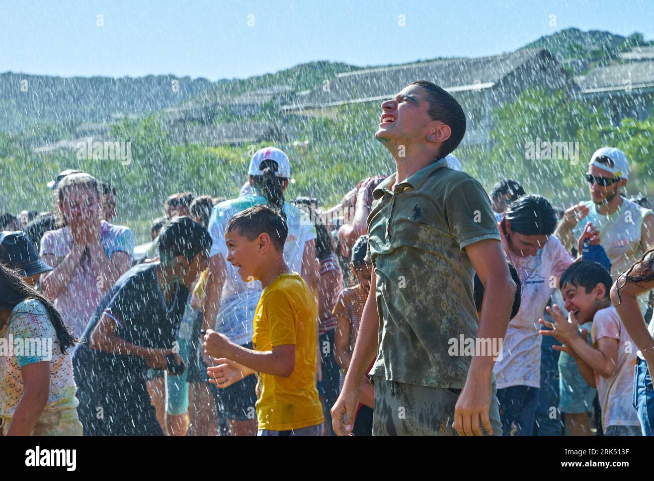 A joyous group of people enjoying the festivities at a festival in ...