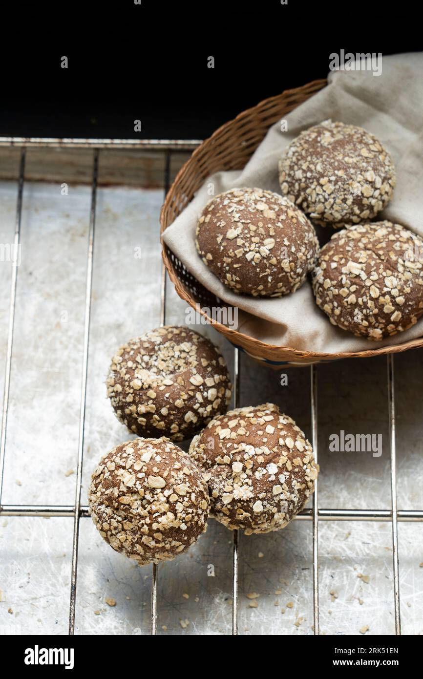A traditional rustic basket filled with freshly baked small buns Stock ...