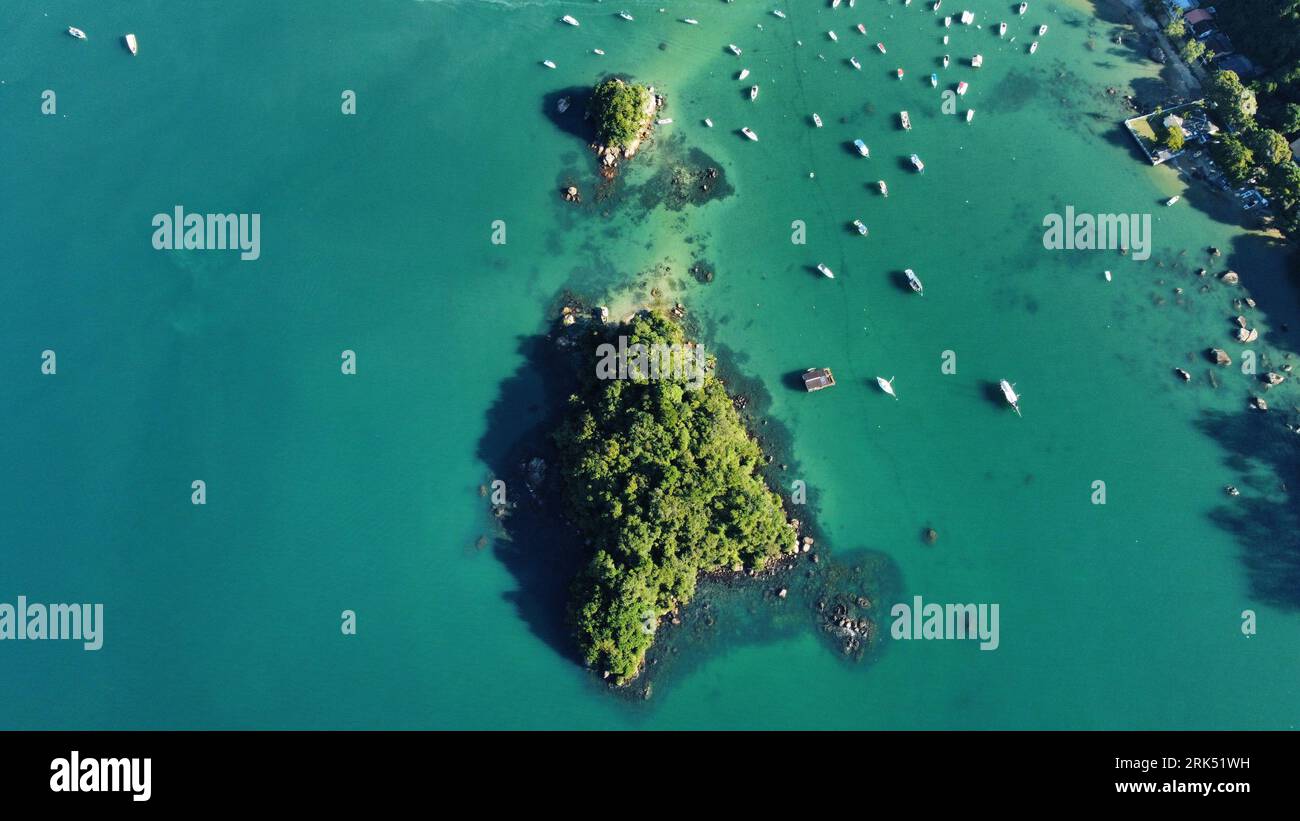 An aerial view of a tropical island and secluded bay in Ilha Grande ...
