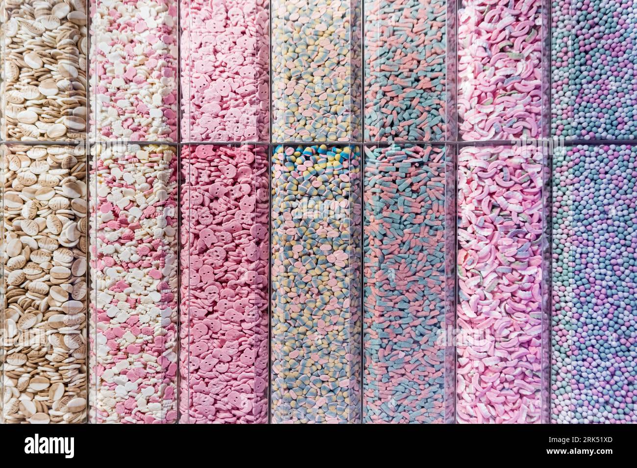showcase of candy shop, transparent container with sweets, candy and ...