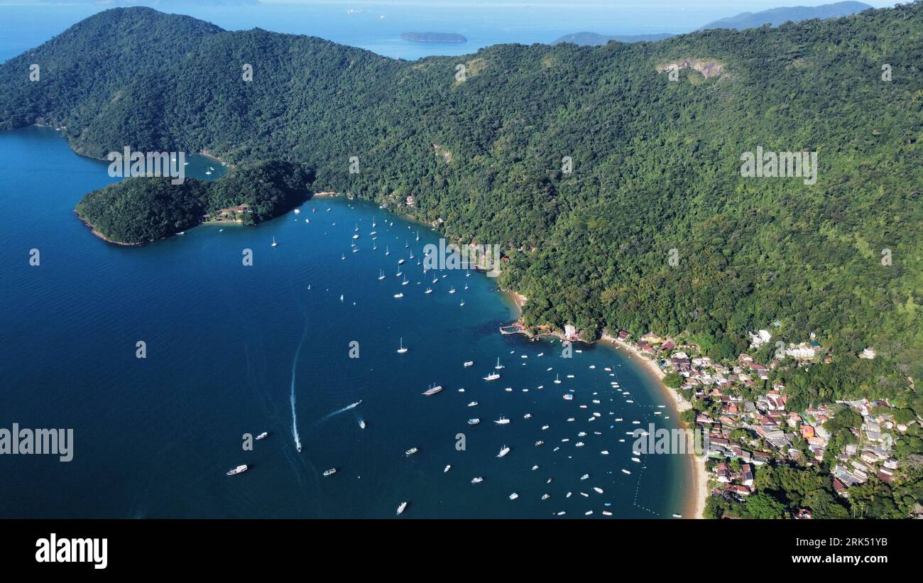 An aerial view of a tropical island and secluded bay in Ilha Grande ...