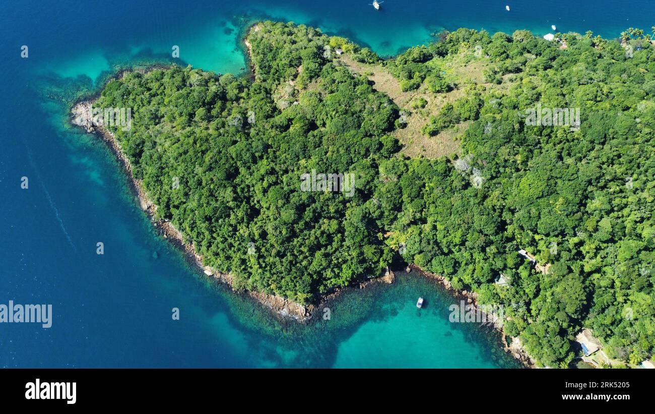 An aerial view of a tropical island and secluded bay in Ilha Grande ...