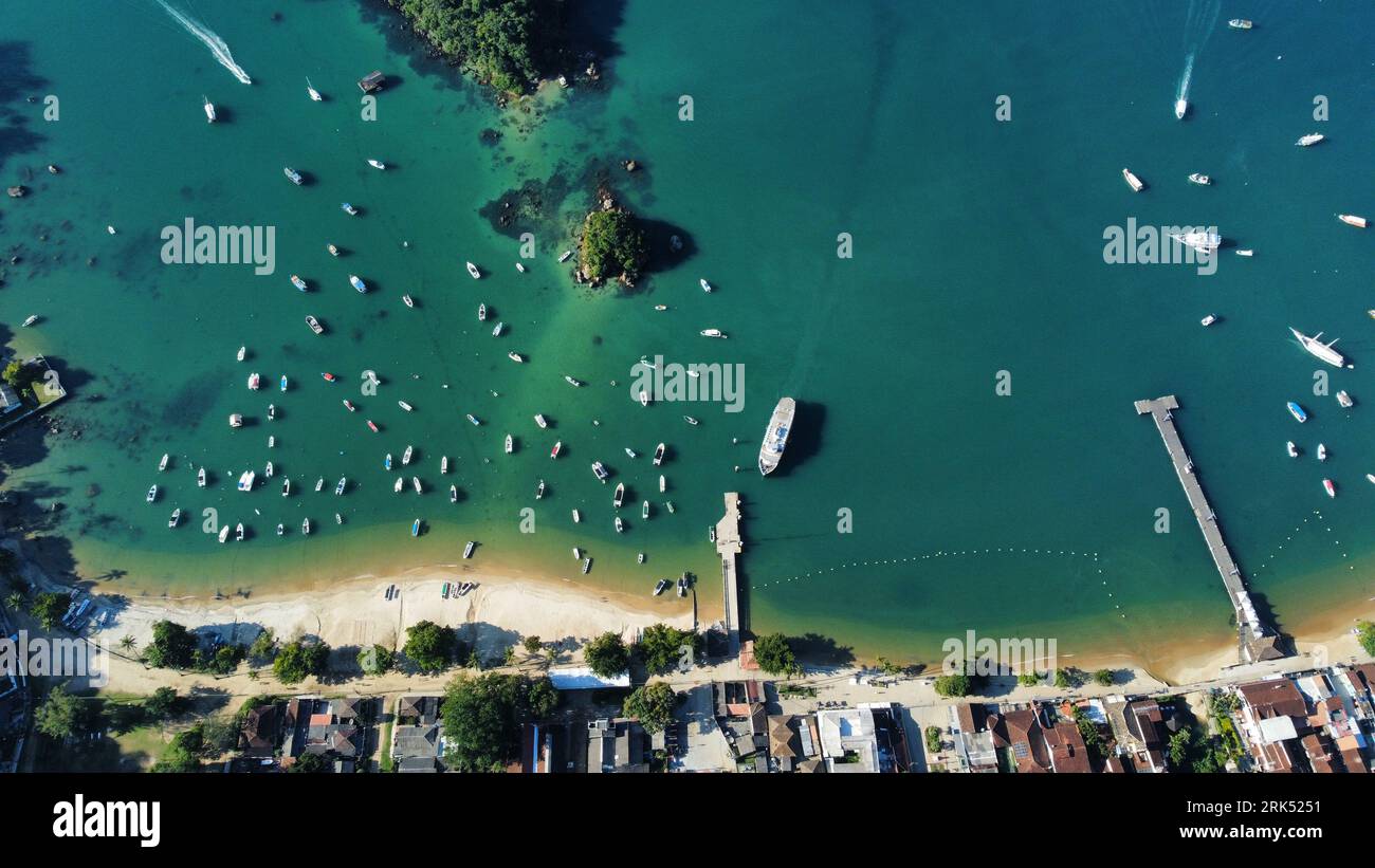An aerial view of a tropical island and secluded bay in Ilha Grande ...