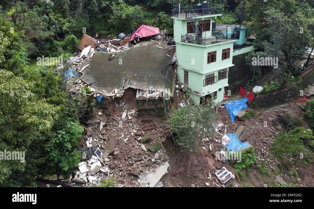 Buildings are seen collapsed following heavy rains in Mandi, Himachal ...