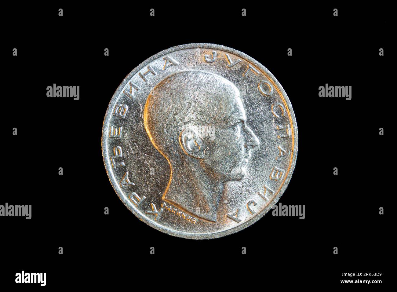 a closeup of King Peter II of Yugoslavia on a coin on the black ...