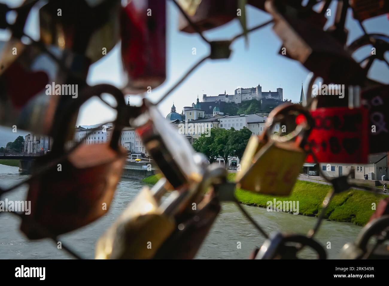 An expansive view of a medieval castle situated over a body of water ...