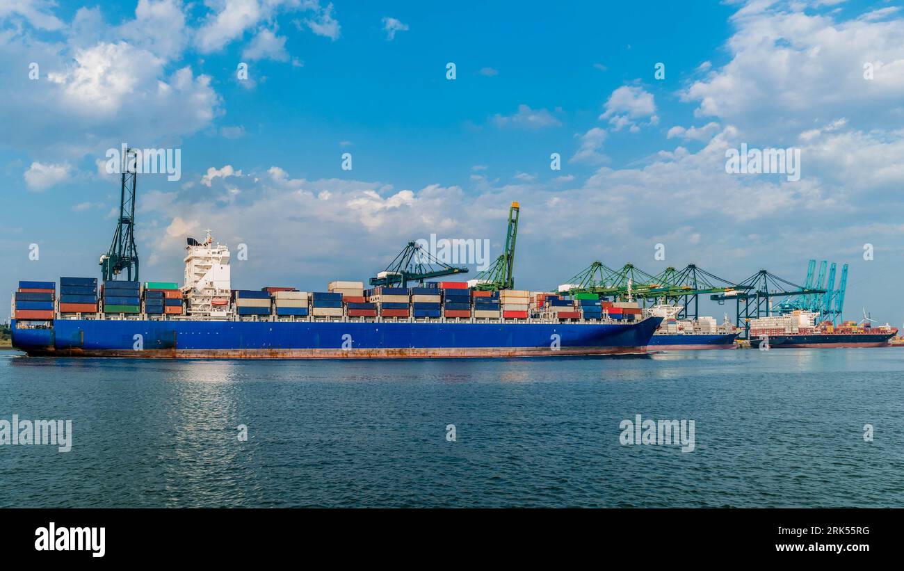 Antwerp, Belgium, view of harbor cranes and container ships in the ...
