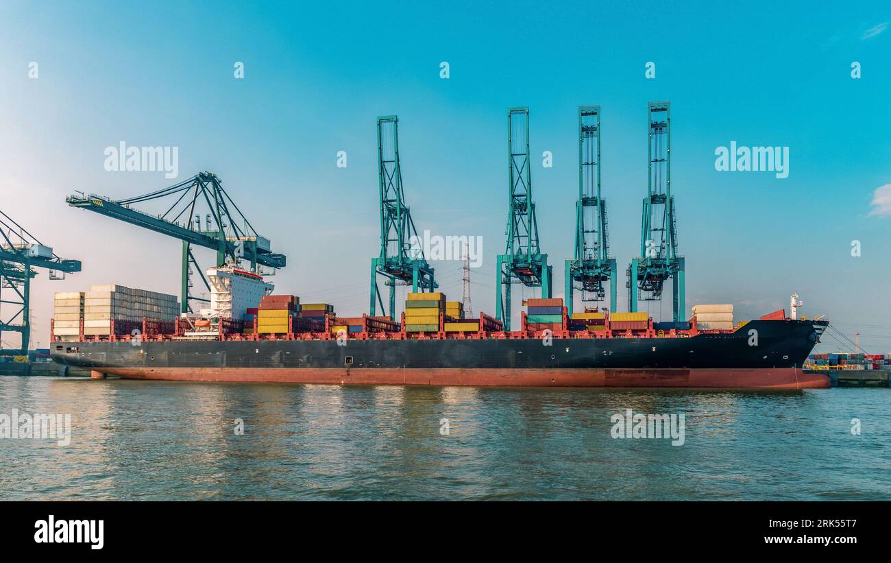 Antwerp, Belgium, view of harbor cranes and container ships in the ...
