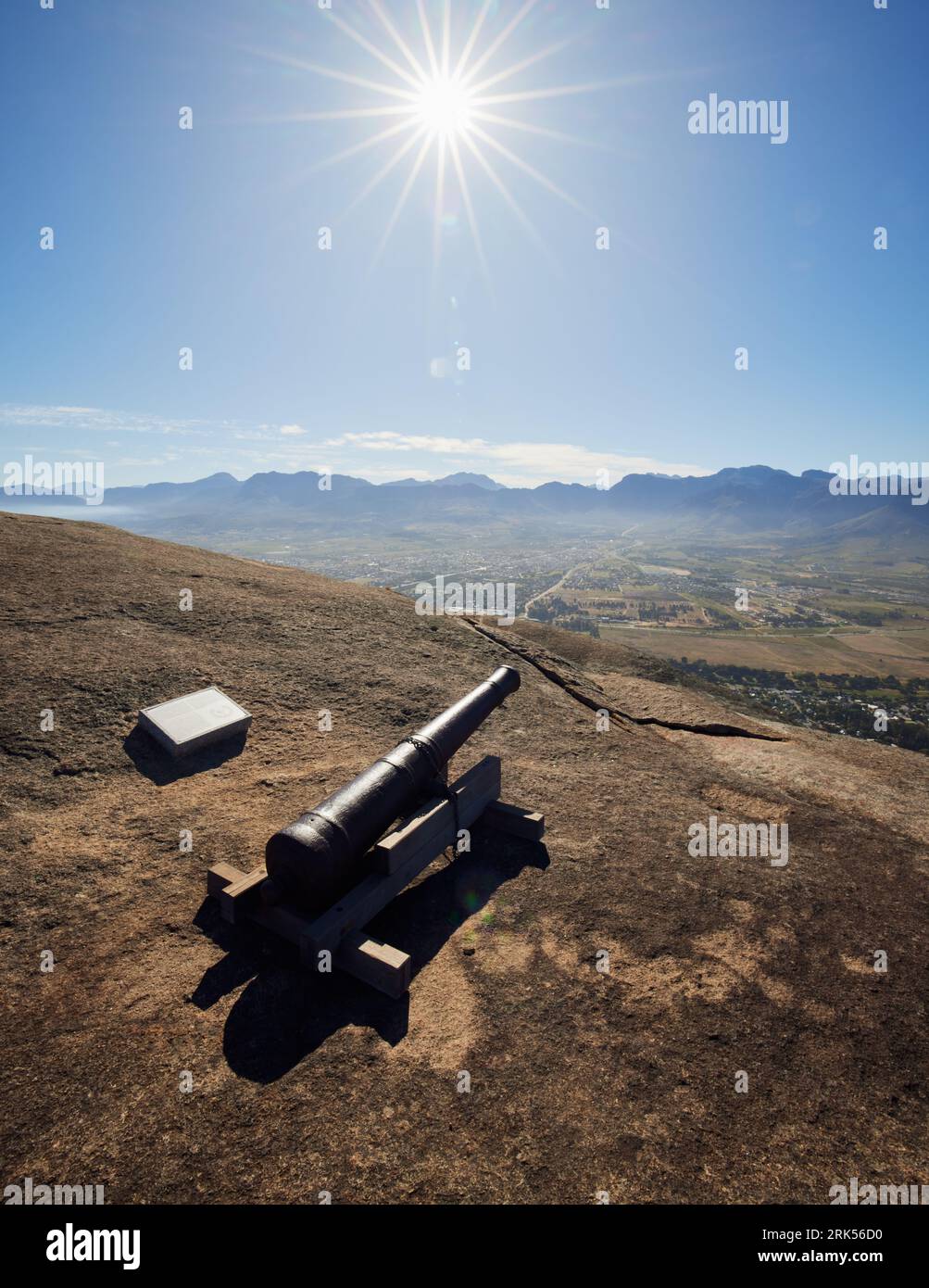 A vertical shot of a historic alarm cannon situated at Paarl Rocks in ...