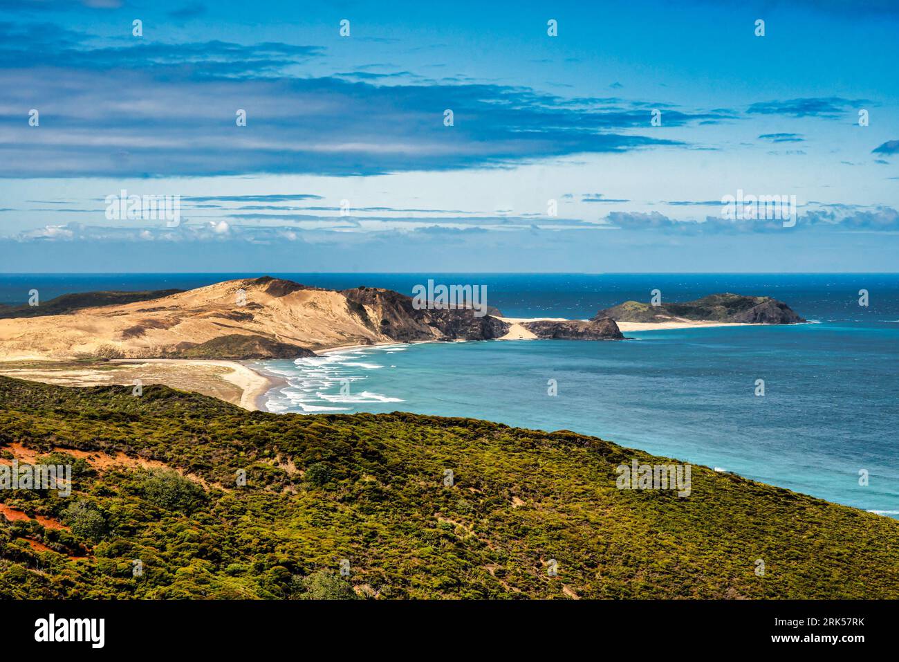 A picturesque view of the coastline of a vast ocean, featuring a sandy ...