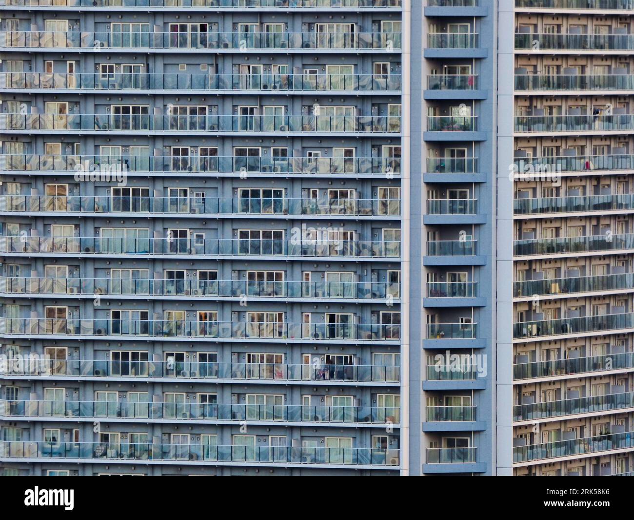 A vibrant metropolitan scene of two large buildings standing side by ...