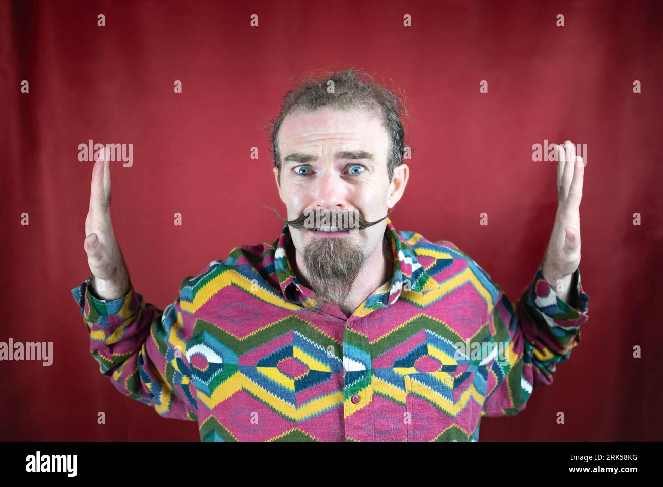 Hipster terrified man with mustache and hands blocking sides with fear ...