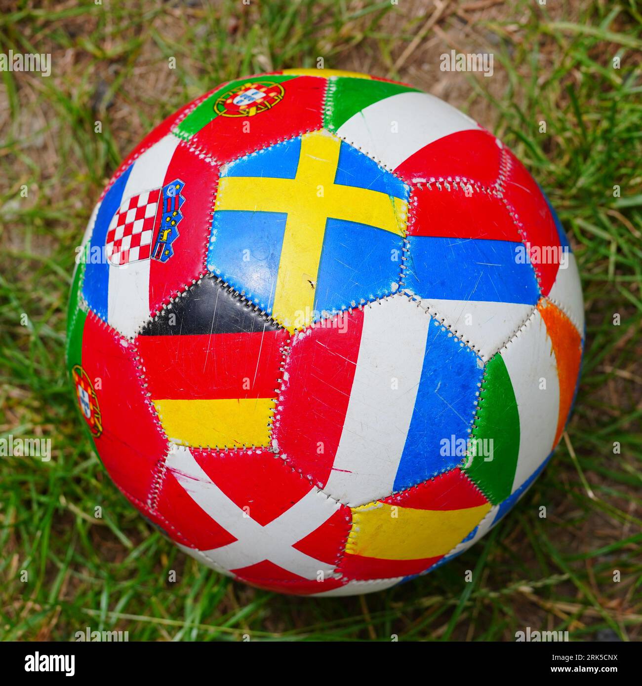 A red ball with various international flags on it with an interesting ...