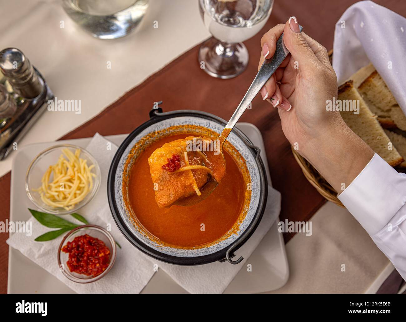 Traditional Hungarian fish soup in a small kettle Stock Photo - Alamy
