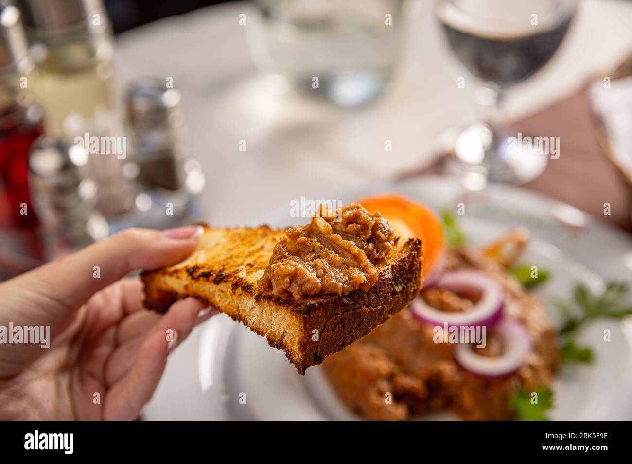 Beef tartare on toast bread served in restaurant Stock Photo - Alamy