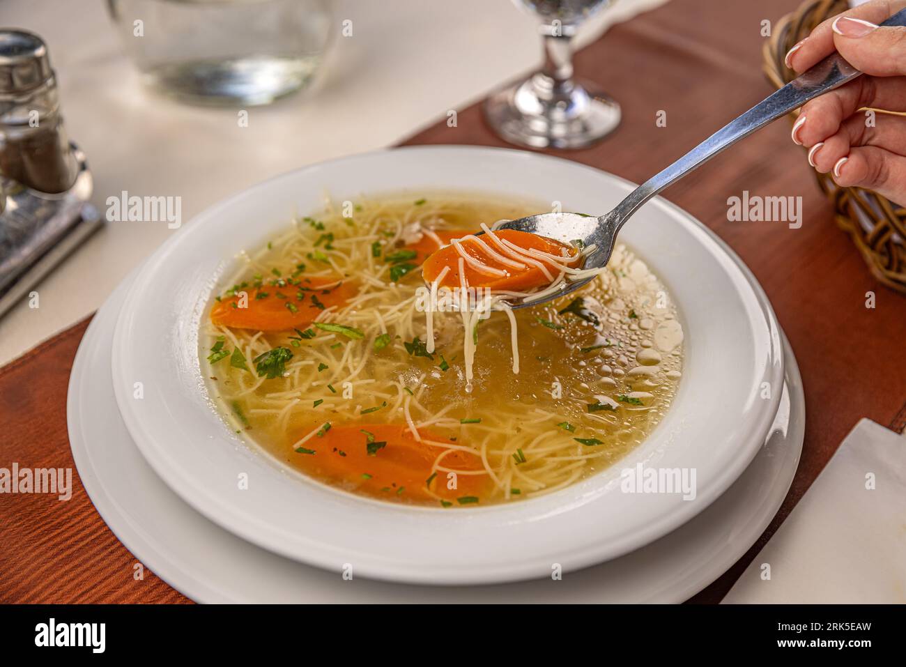 Woman eating fresh chicken noodle soup in restaurant Stock Photo - Alamy Woman eating fresh chicken noodle soup in restaurant Stock Photo - Alamy