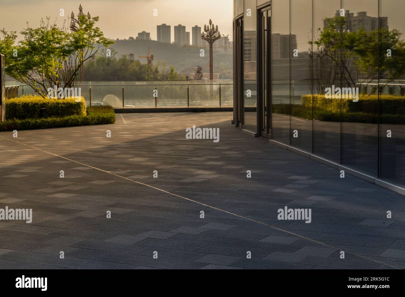 An empty floor outside of a modern office building during sunrise Stock ...